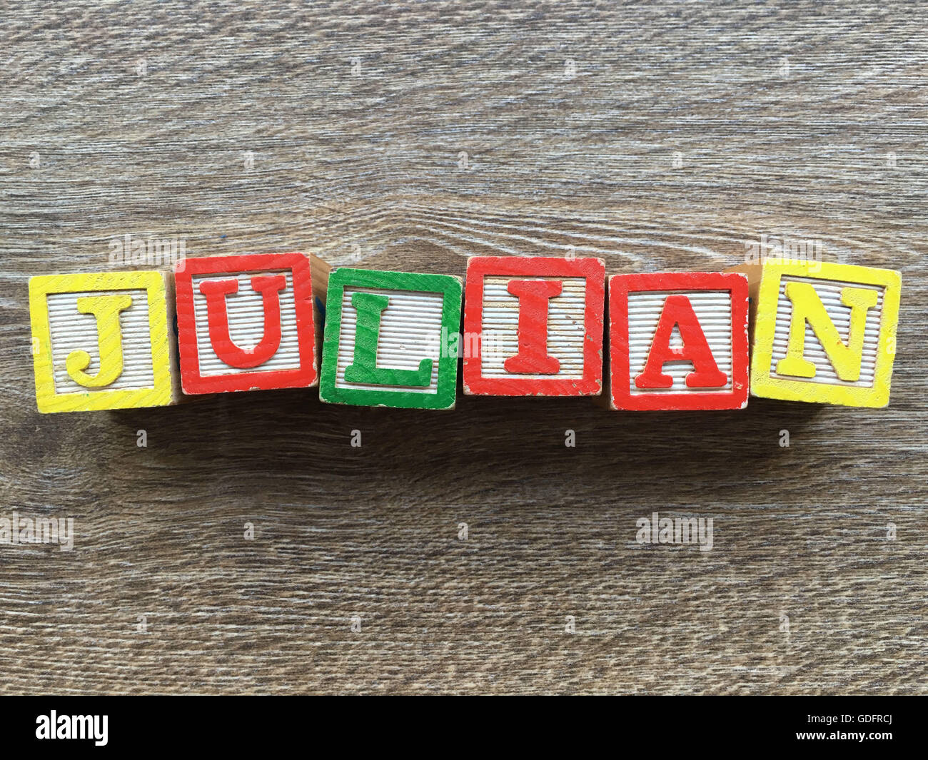 Julian name written with wood block letter toys Stock Photo - Alamy