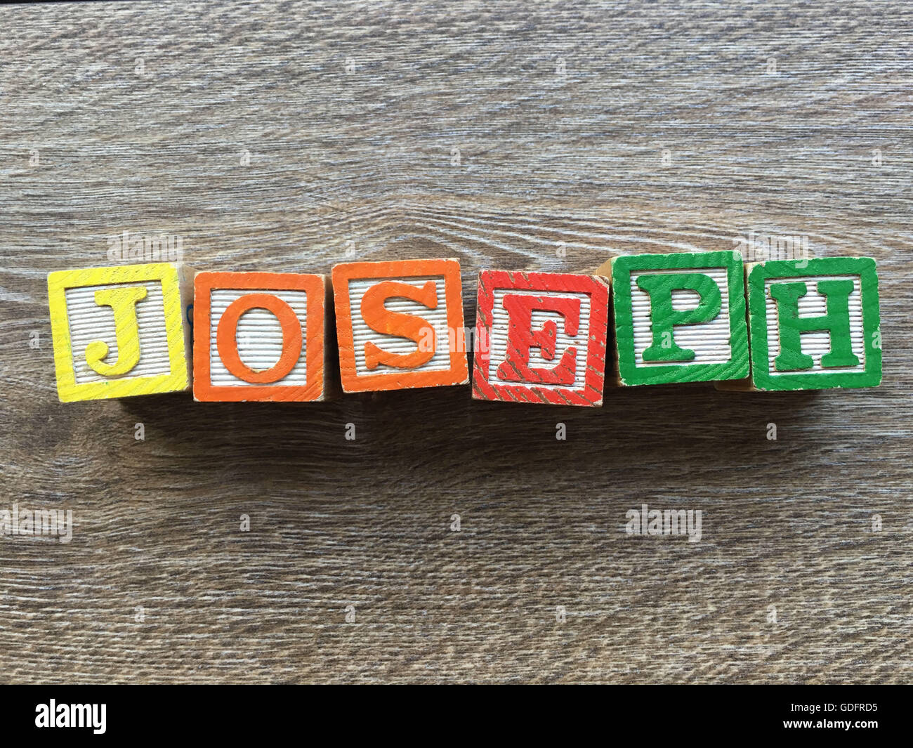Joseph name written with wood block letter toys Stock Photo - Alamy