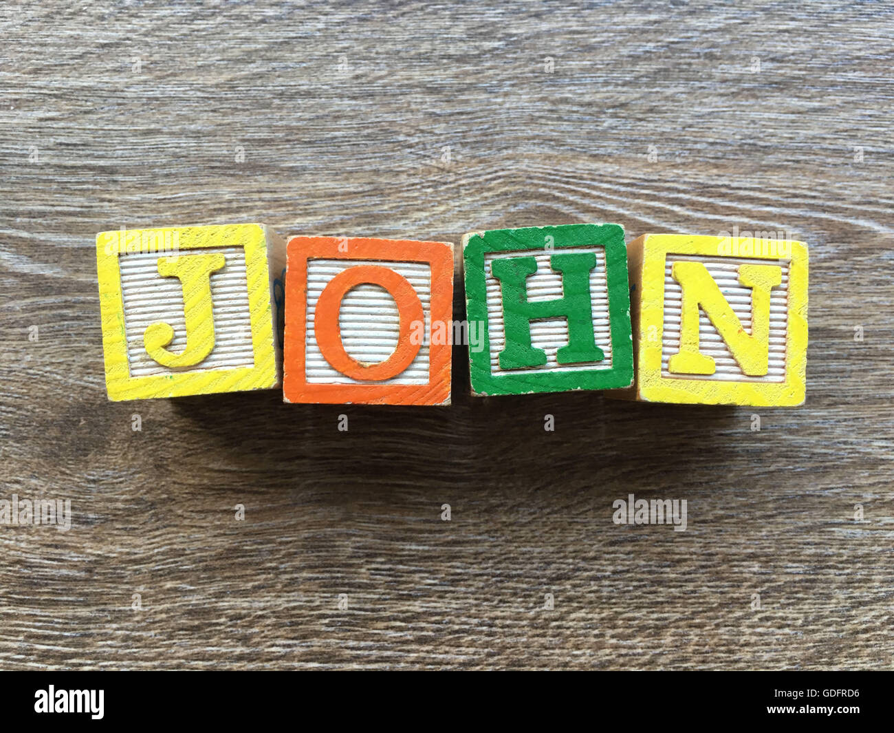 John name written with wood block letter toys Stock Photo - Alamy