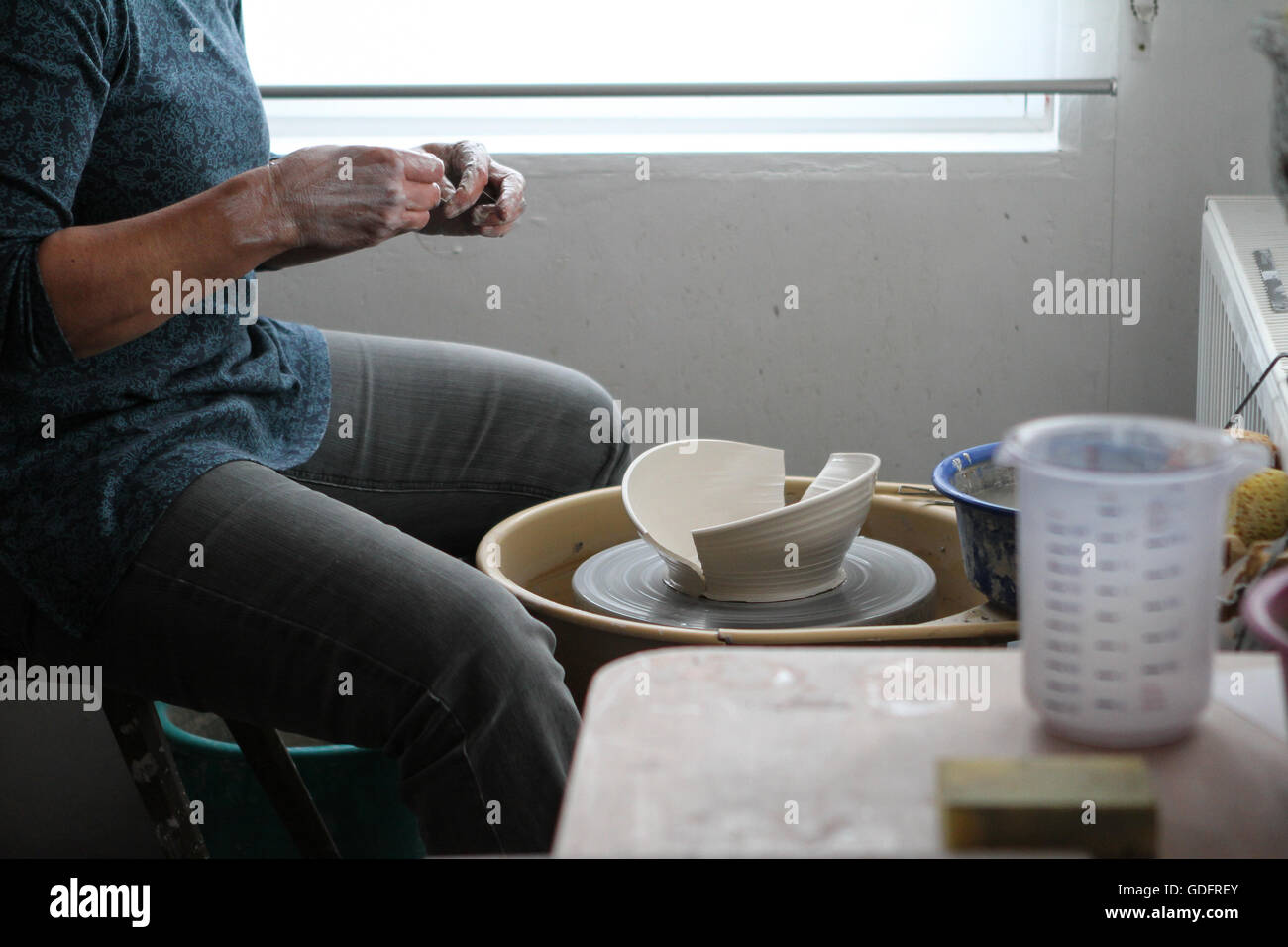 Potter works. Crockery creation process in pottery on potters' wheel ...
