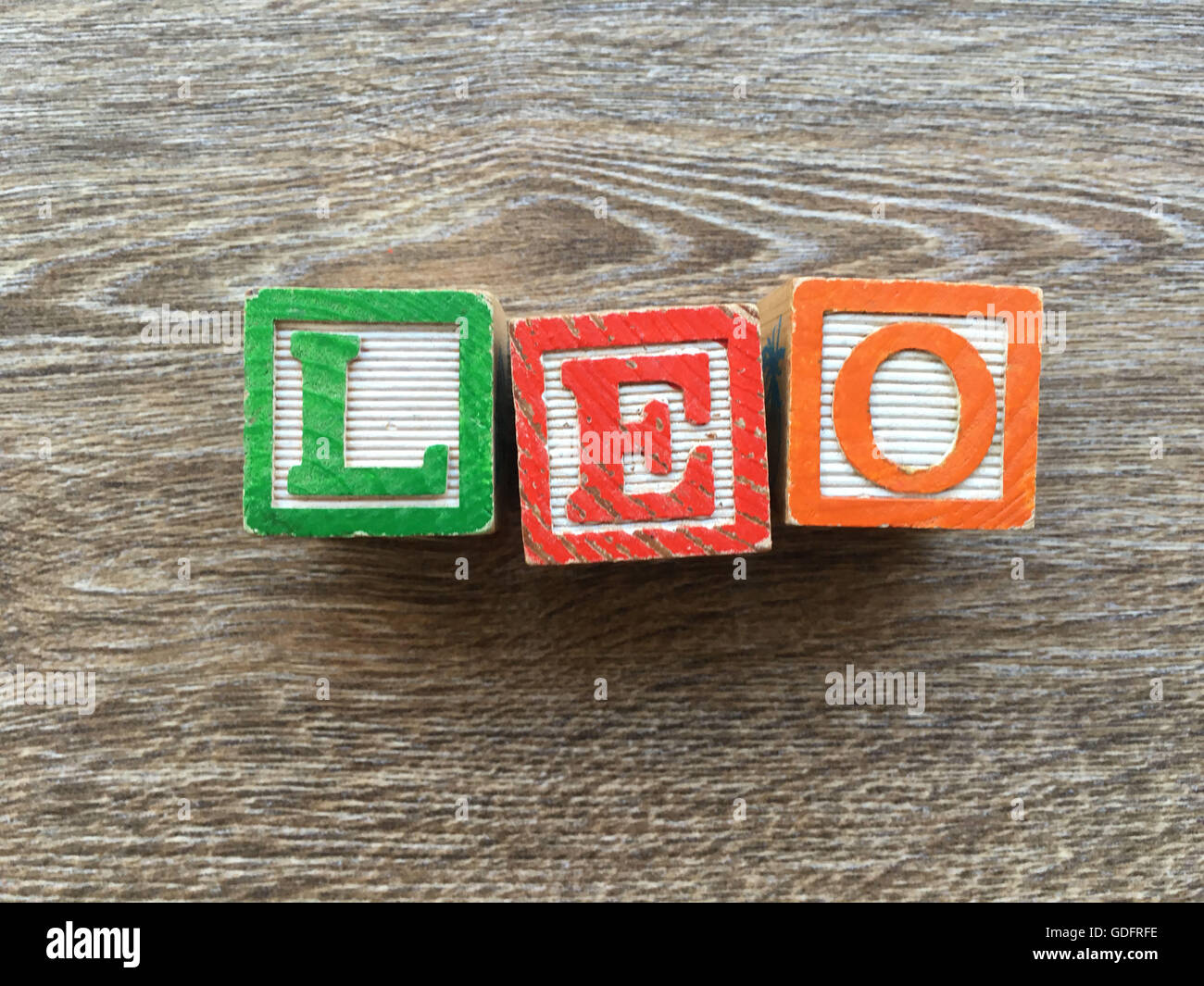 Leo name written with wood block letter toys Stock Photo - Alamy