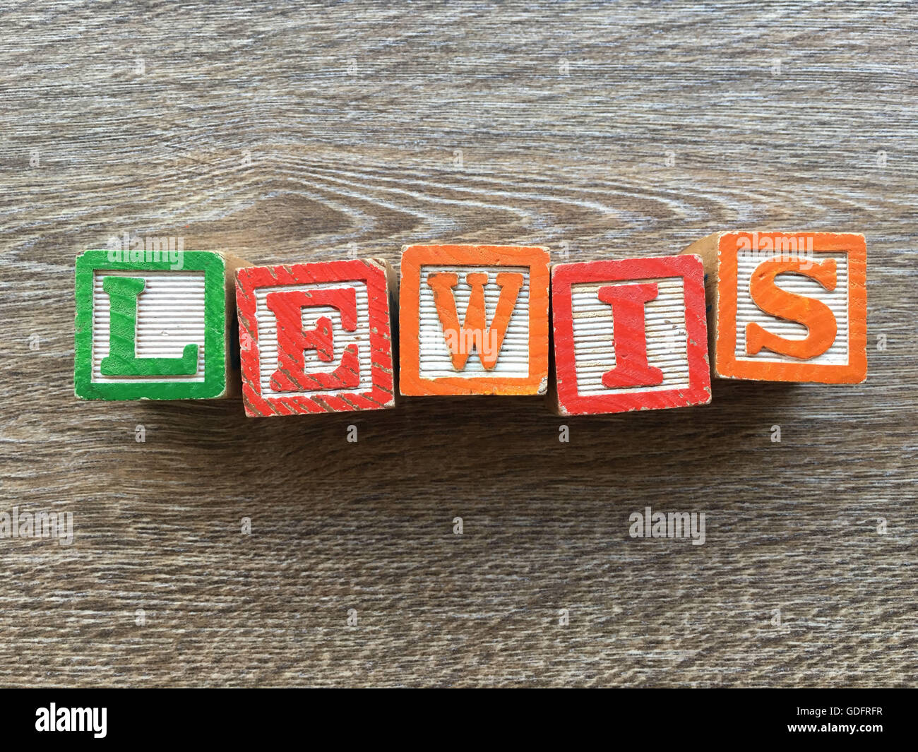 Lewis name written with wood block letter toys Stock Photo - Alamy