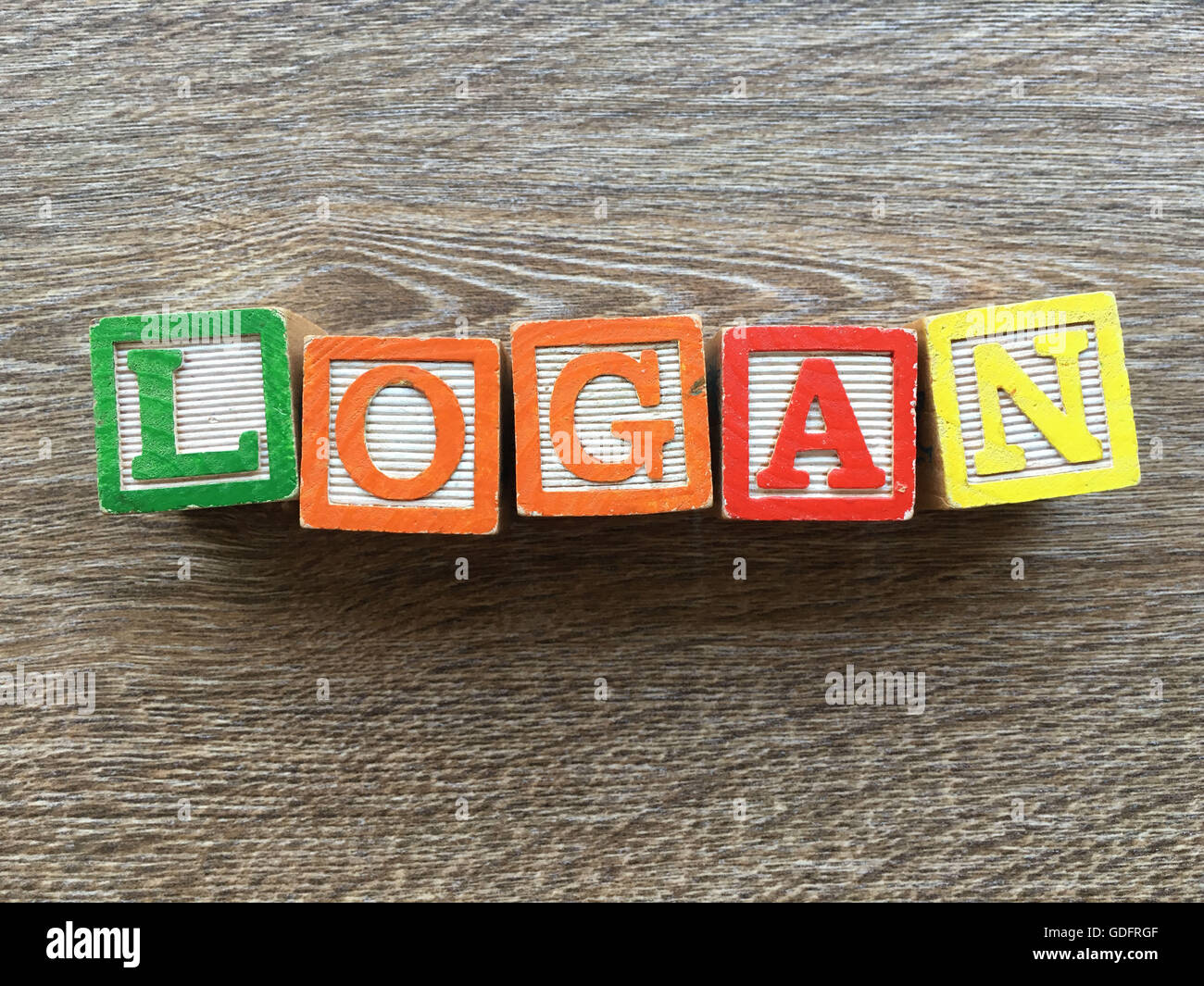 Logan name written with wood block letter toys Stock Photo - Alamy