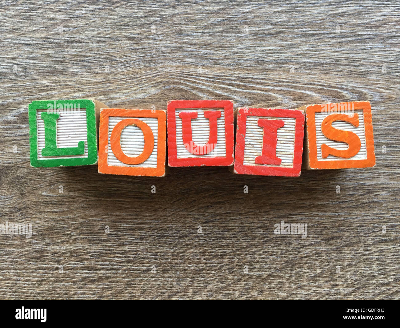 Louis name written with wood block letter toys Stock Photo - Alamy