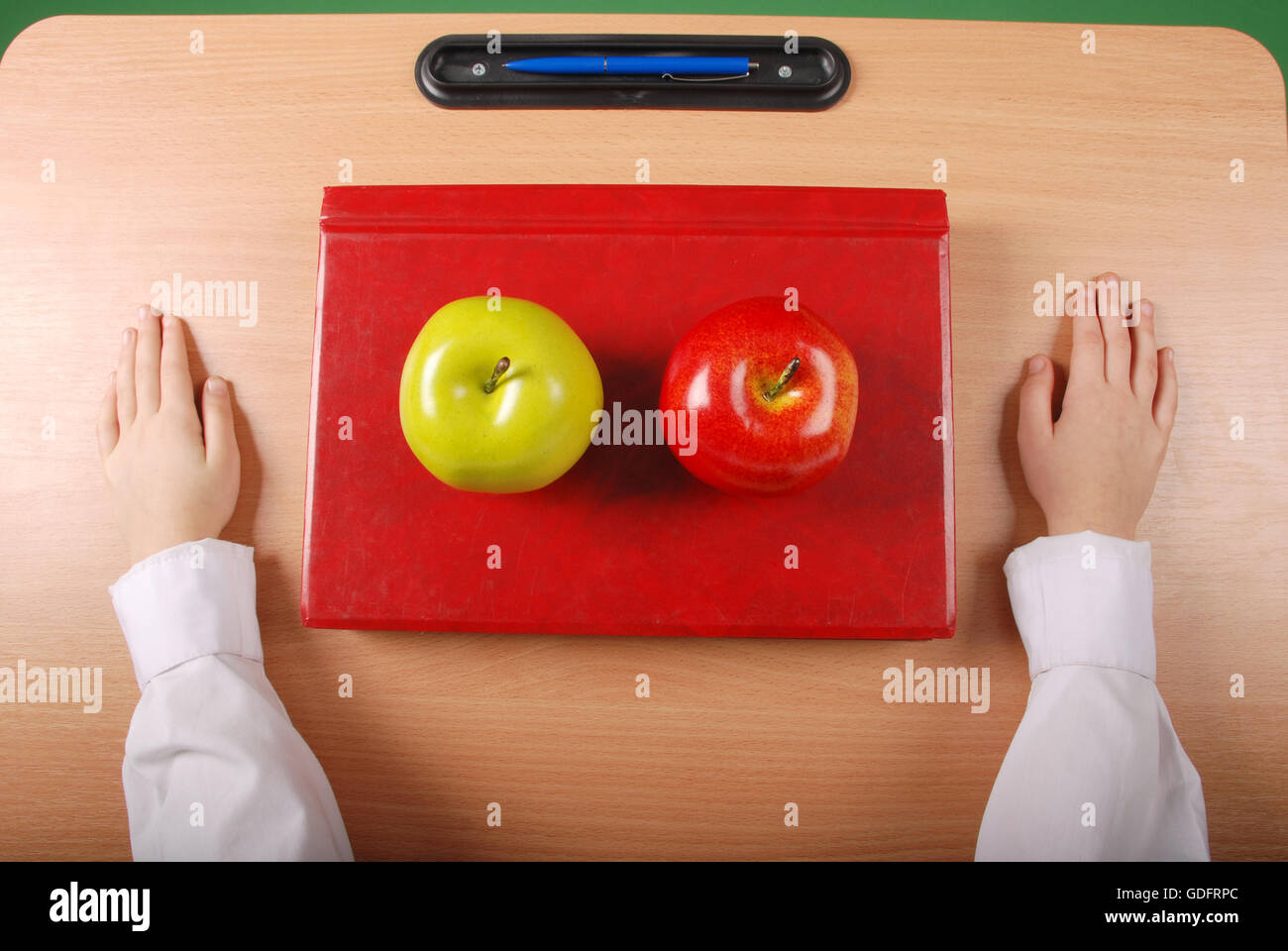 Preparation for school. Desk isolated on green background Stock Photo ...