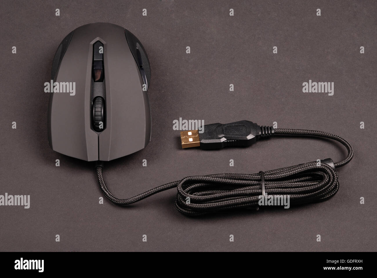 Black computer optical mouse isolated on black background with soft ...