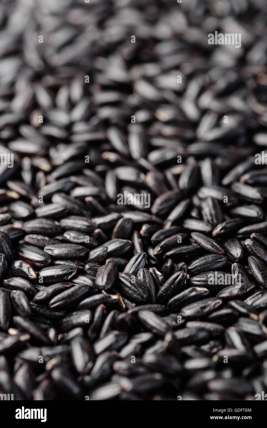 food background of black rice Stock Photo - Alamy