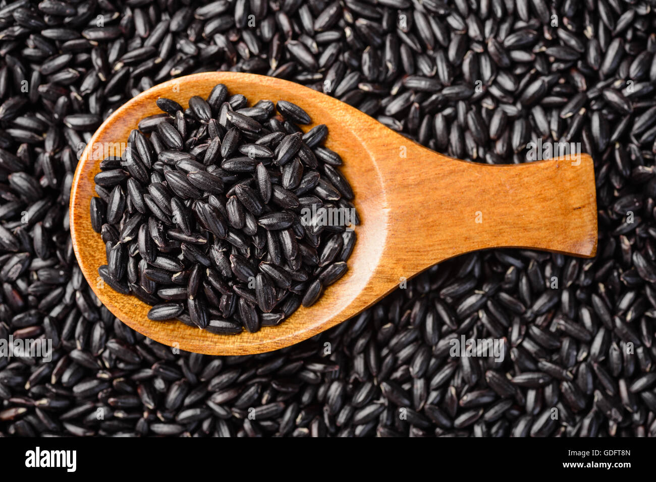 food background of black rice Stock Photo - Alamy