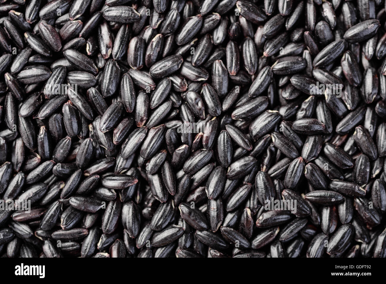 food background of black rice Stock Photo - Alamy