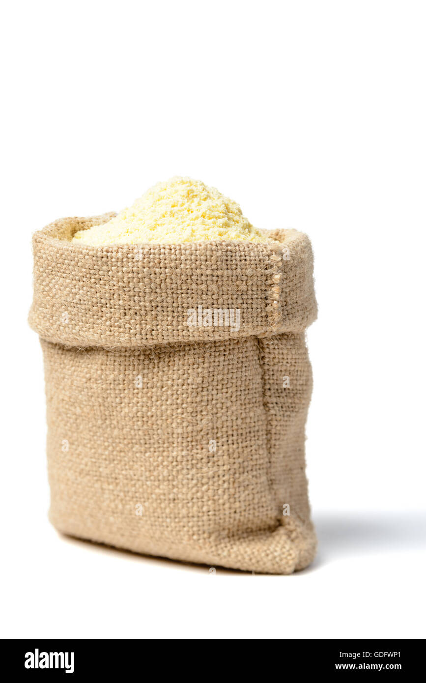 uncooked corn flour in sack on the white, (large depth of field, taken ...