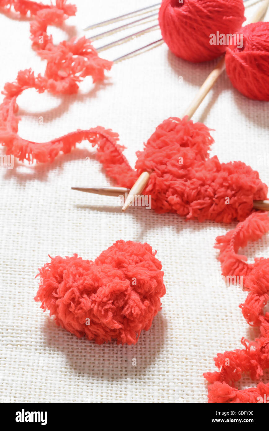 red knitting heart and needles Stock Photo - Alamy
