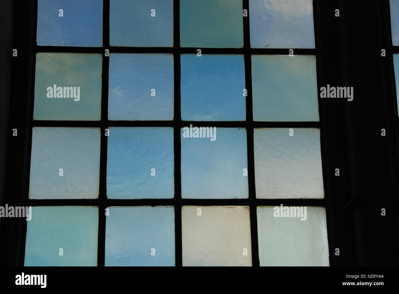 Looking through stained glass window hi-res stock photography and ...