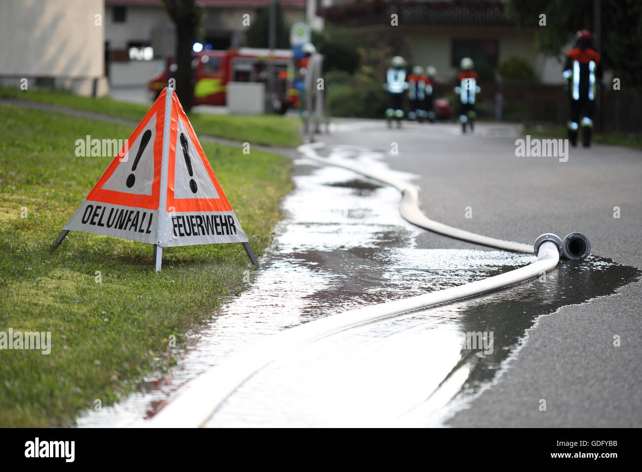 Firefighters traffic sign and hoses Stock Photo - Alamy