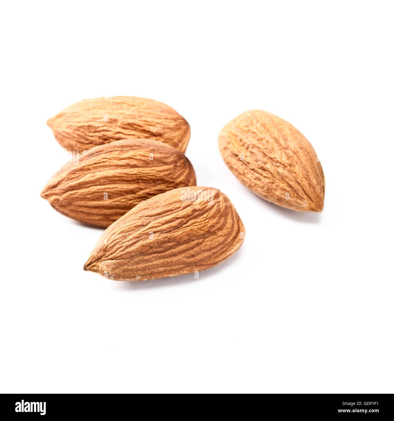 dried almond nuts on the white background Stock Photo - Alamy