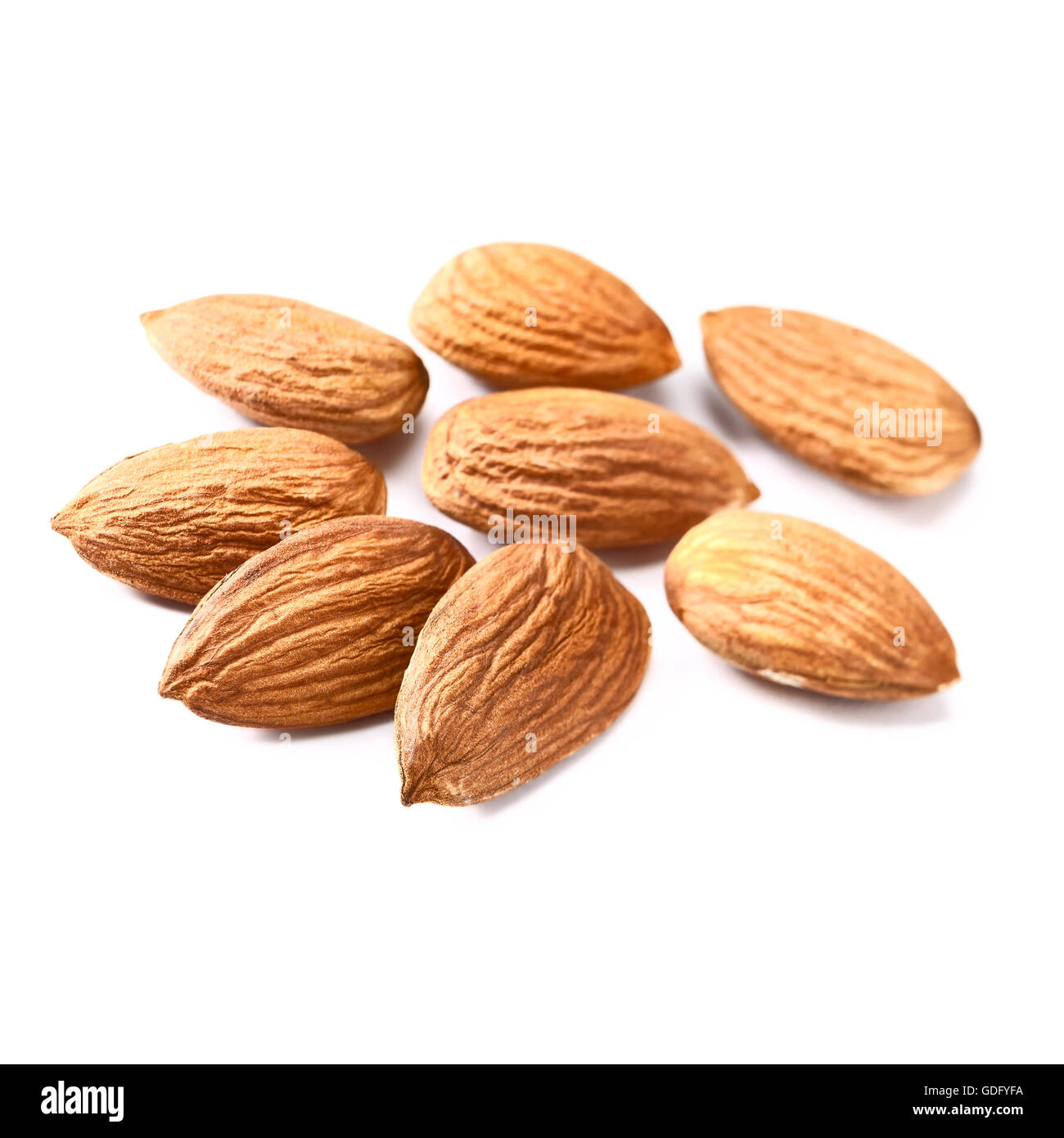 dried almond nuts on the white background Stock Photo - Alamy