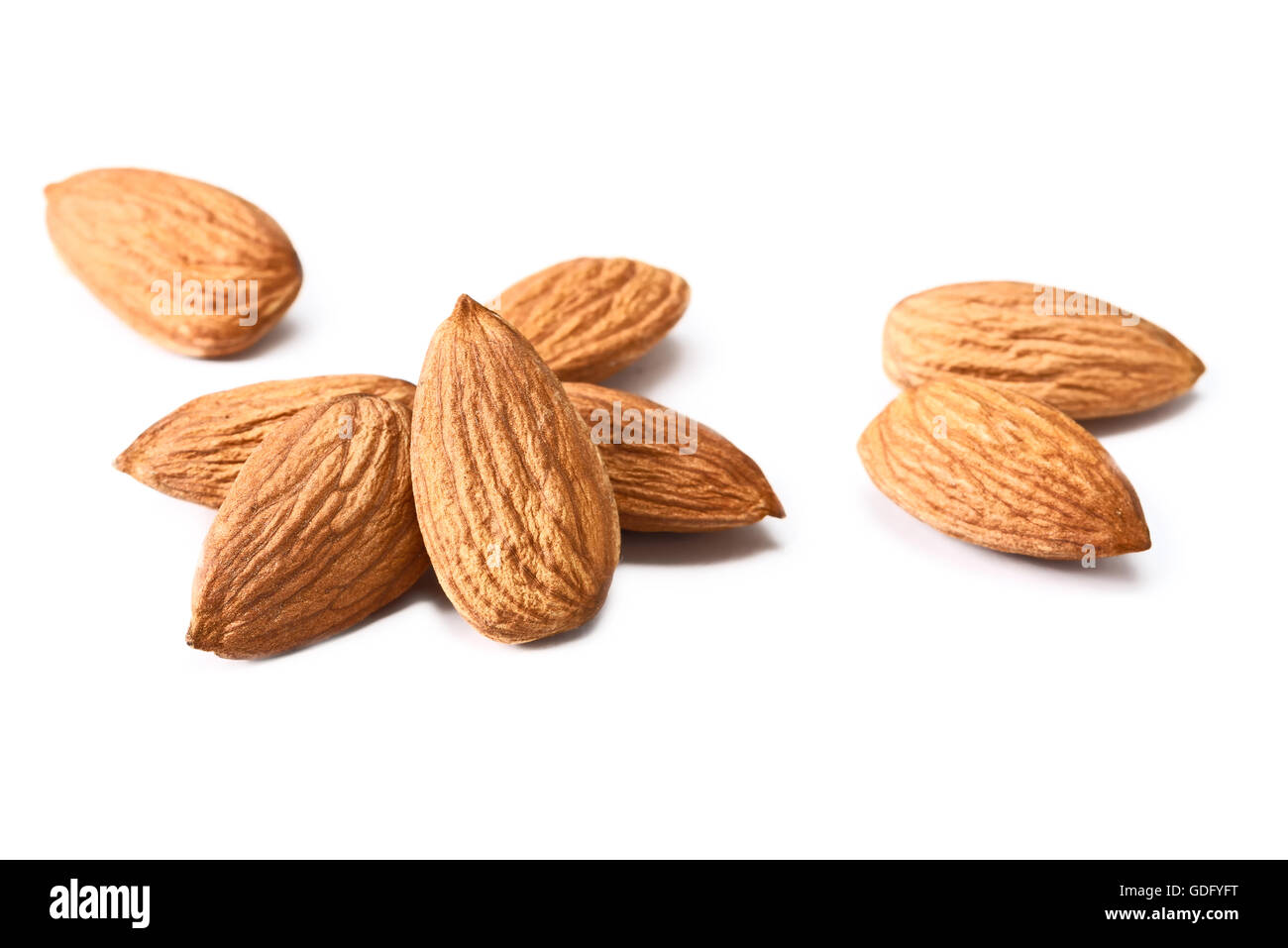 dried almond nuts on the white background Stock Photo - Alamy