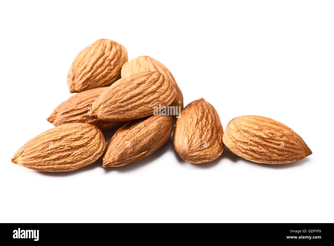 dried almond nuts on the white background Stock Photo - Alamy