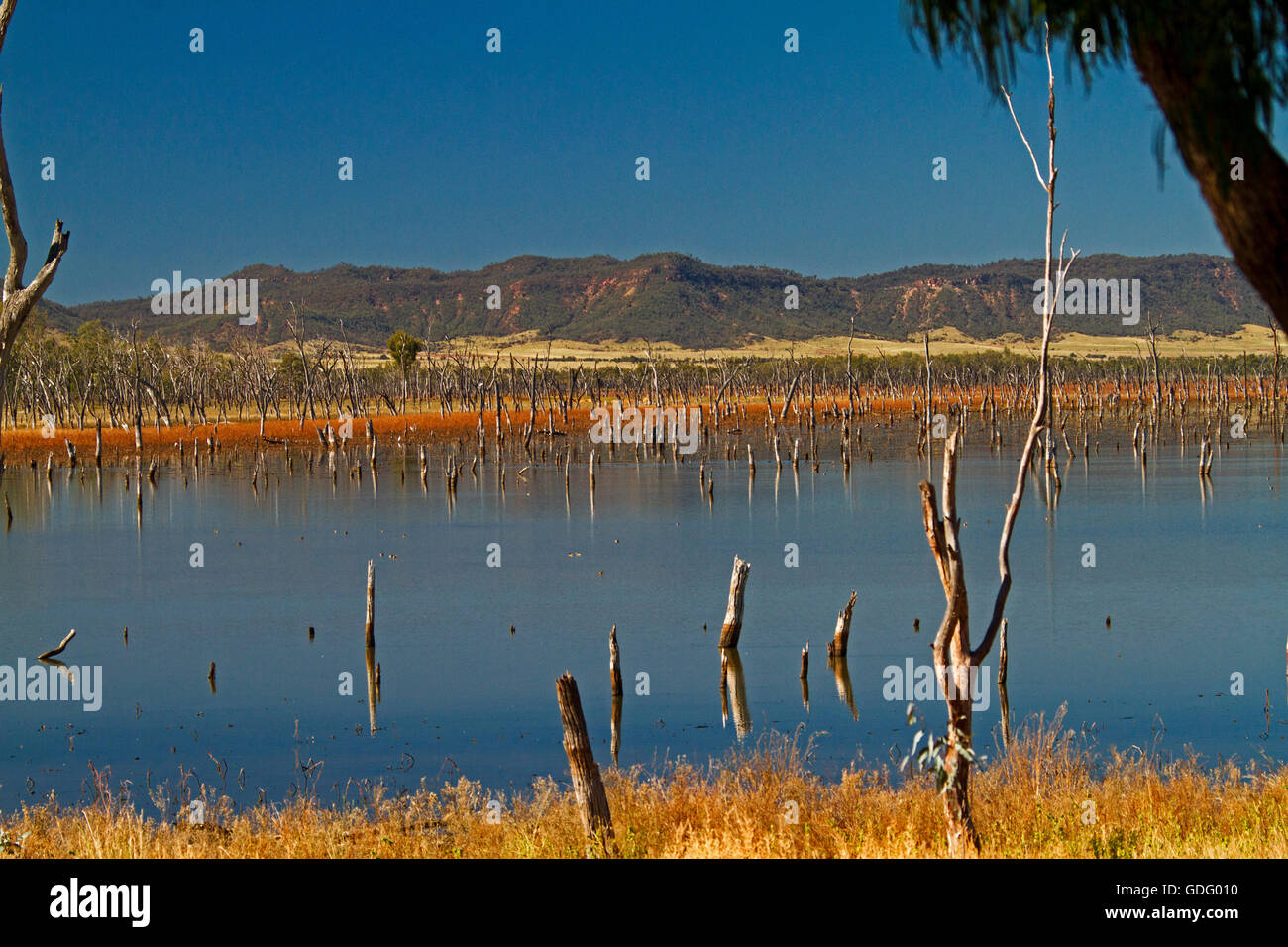 Vast calm blue waters of Lake Nuga Nuga with rugged Carnarvon ranges on ...