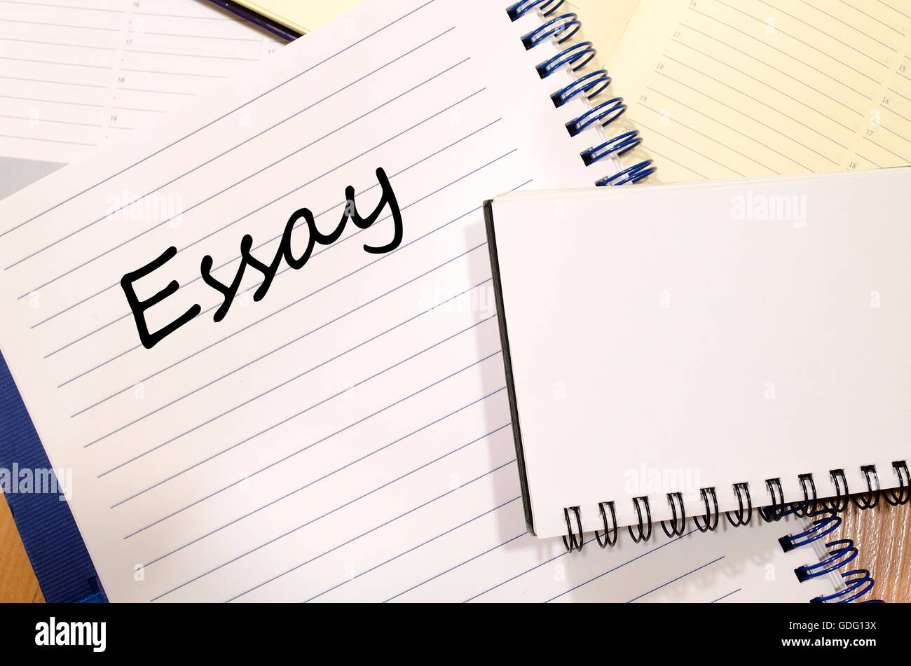 Essay text concept write on notebook Stock Photo - Alamy