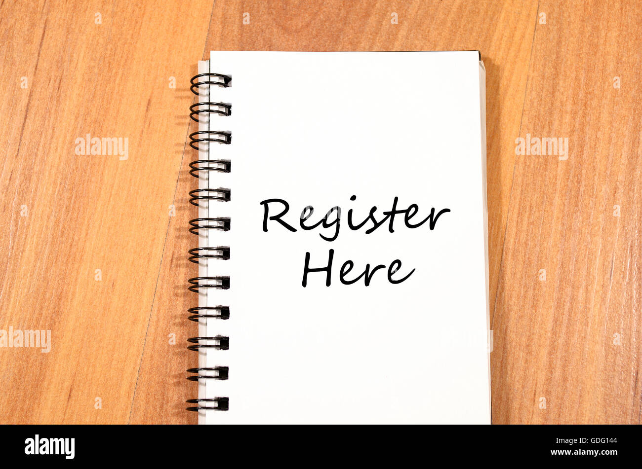 Register here text concept write on notebook Stock Photo - Alamy