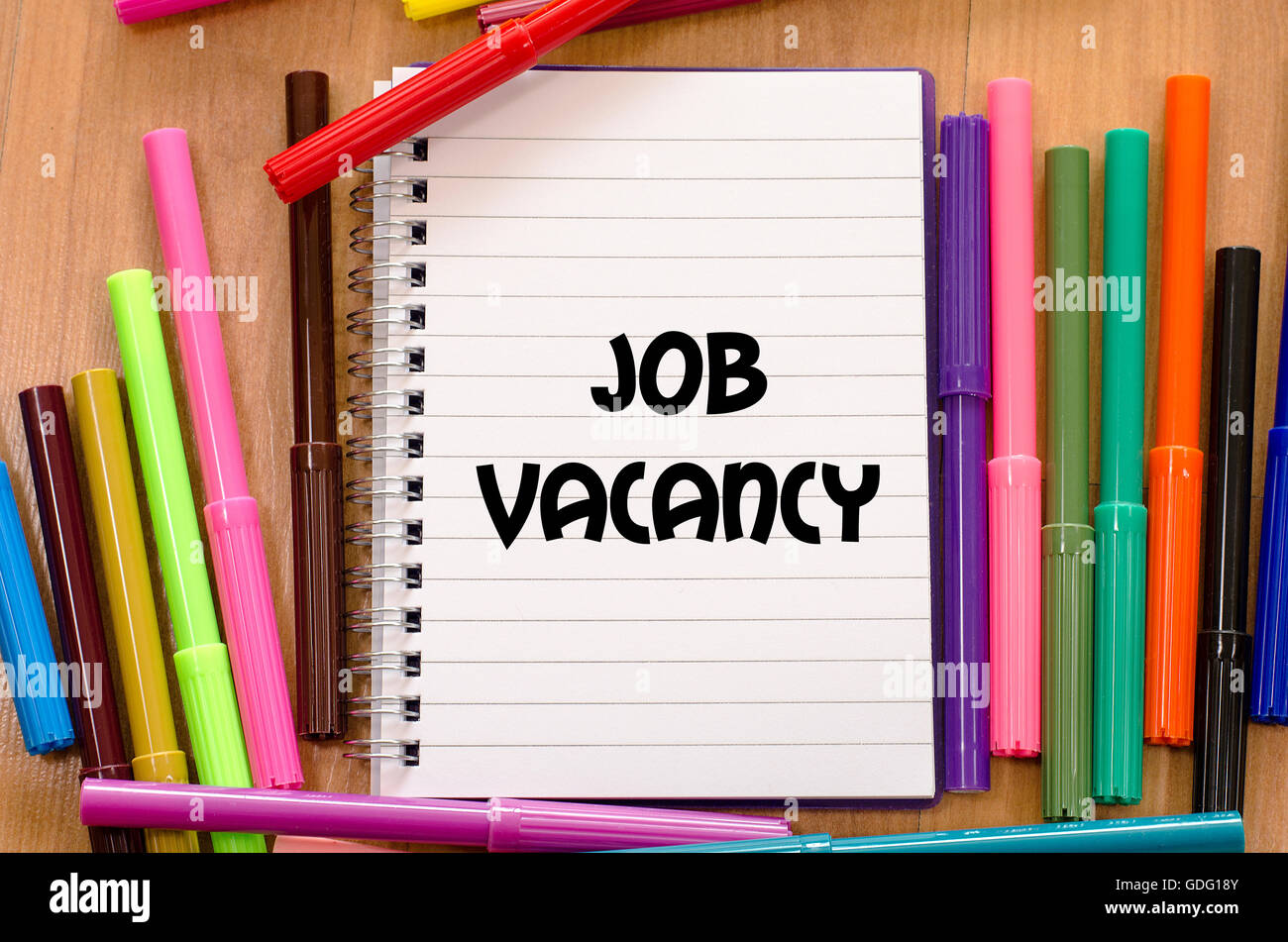Job vacancy written on notebook over wooden background Stock Photo - Alamy