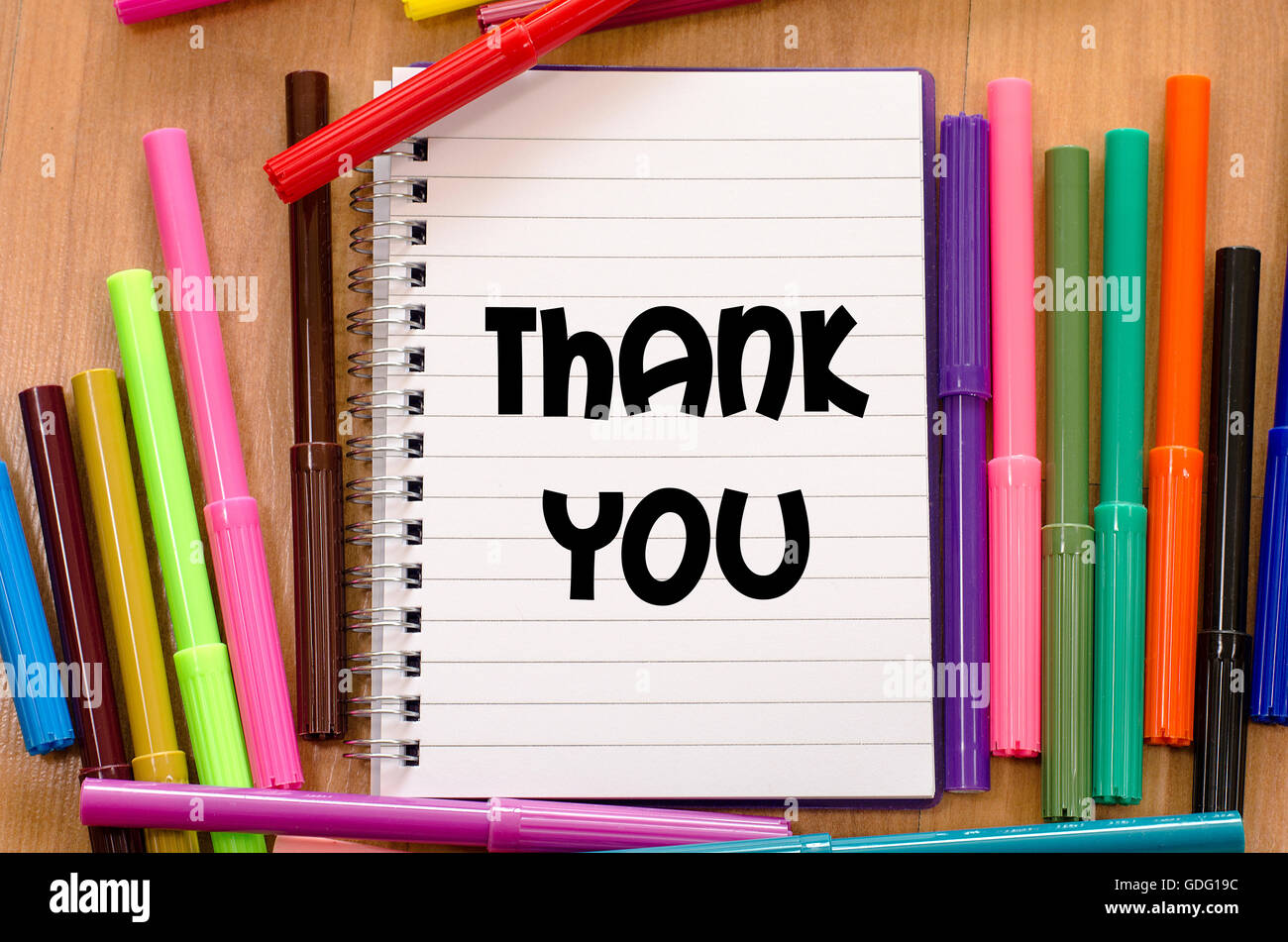 Thank you written on notebook over wooden background Stock Photo - Alamy