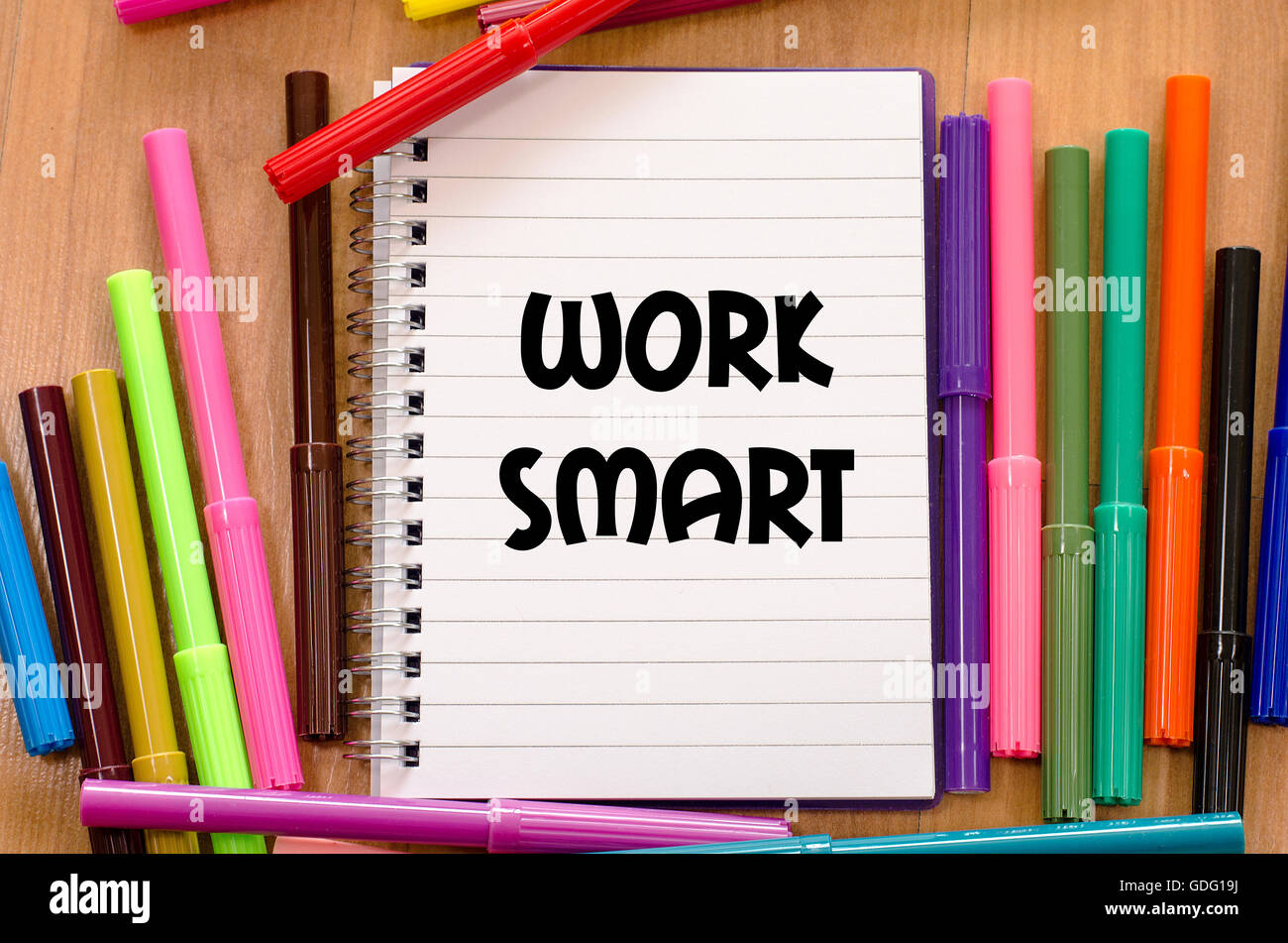 Work smart written on notebook over wooden background Stock Photo - Alamy