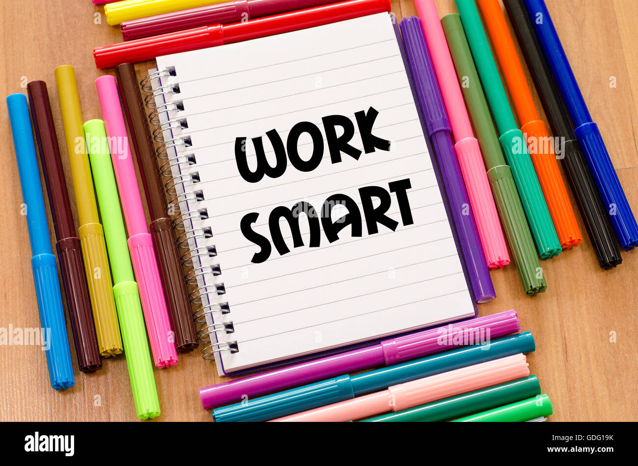 Work smart written on notebook over wooden background Stock Photo - Alamy