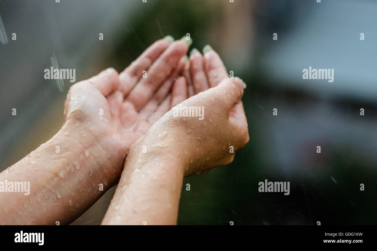 Hands catching clean falling water hi-res stock photography and images ...