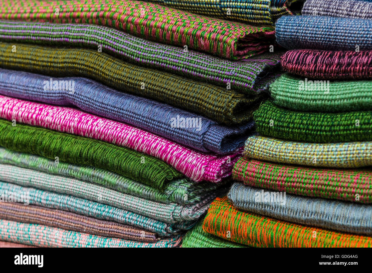 Pile of knitted colorful bhutanese fabrics texture - abstract ...