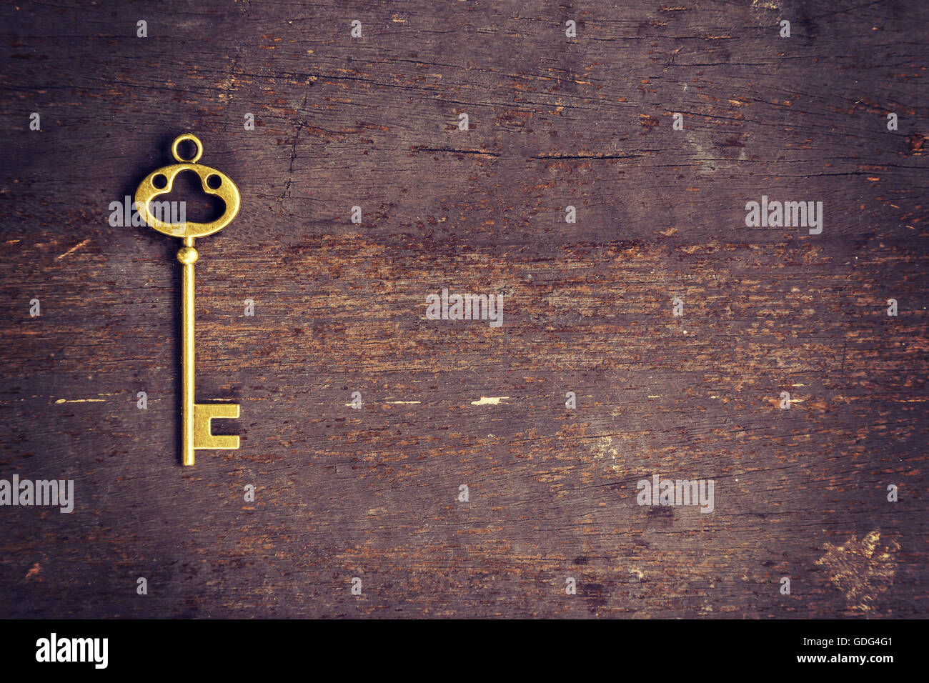 old key on wood background with space Stock Photo - Alamy