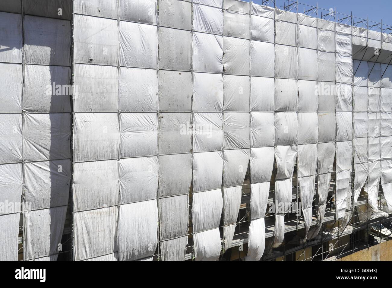 dust cover on the facade of a building under renovation Stock Photo - Alamy