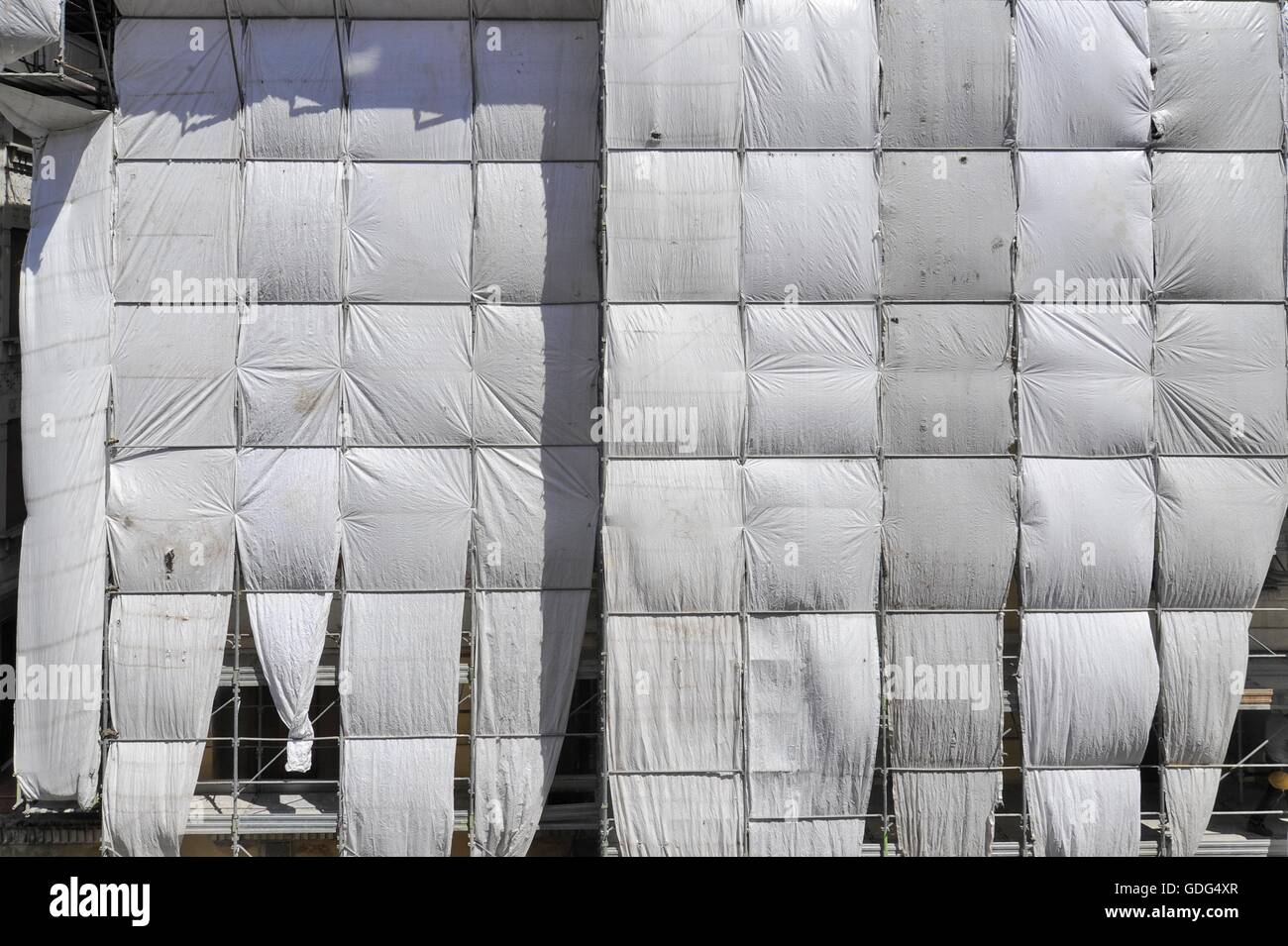 dust cover on the facade of a building under renovation Stock Photo - Alamy