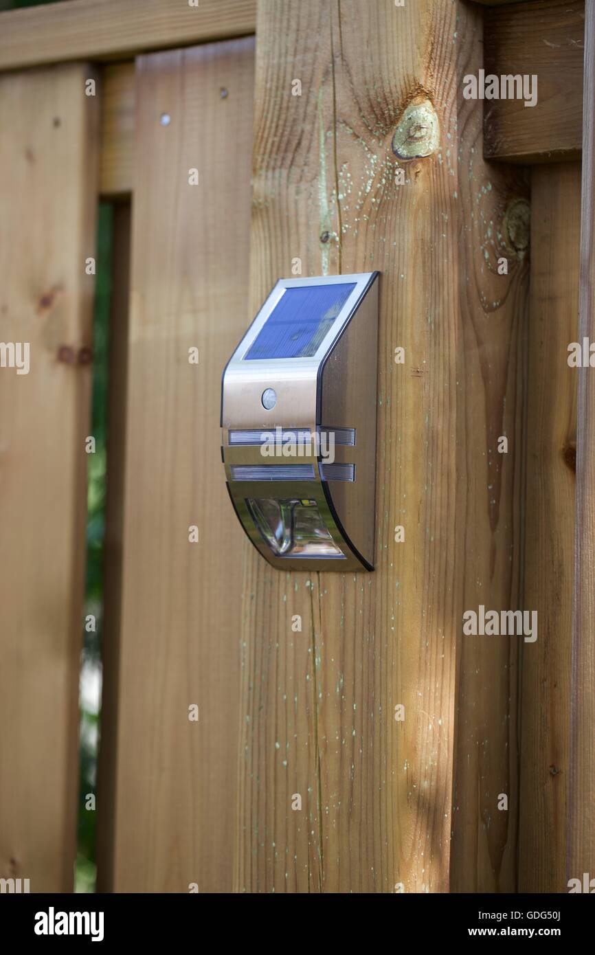 Solar powered garden LED light with motion activation fence mounted ...
