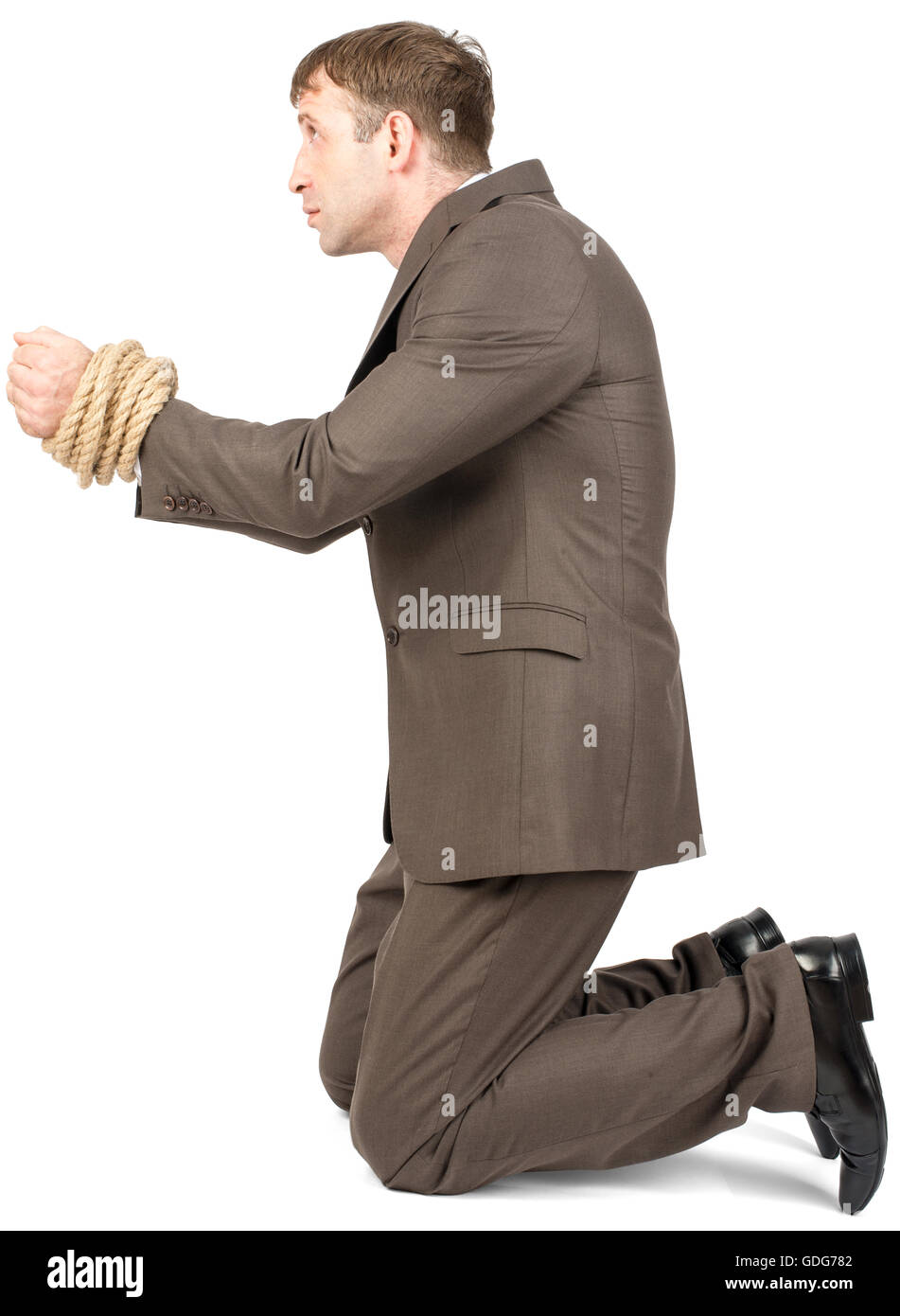 Man kneeling suit hi-res stock photography and images - Alamy