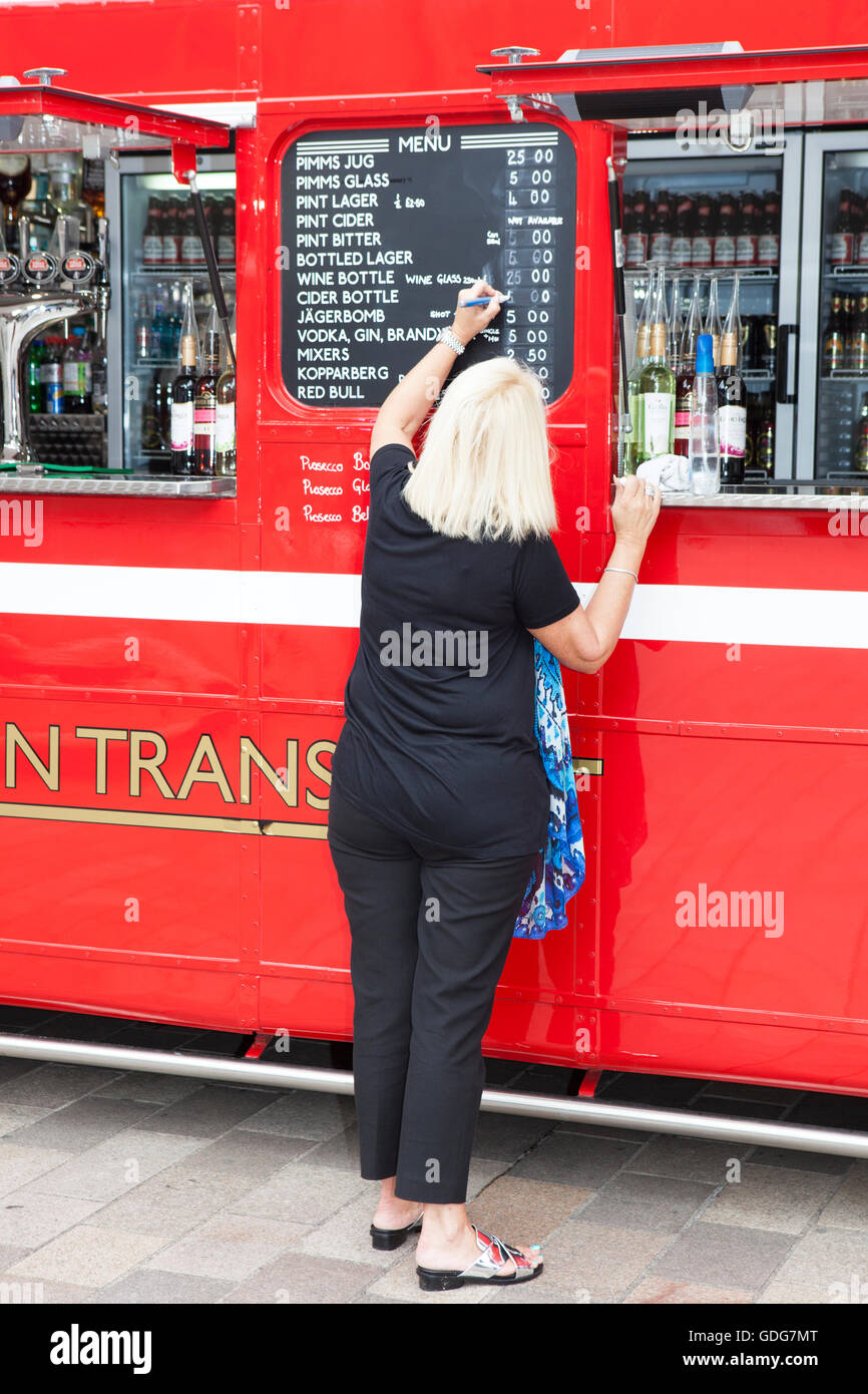 A red London double decker bus used as a mobile bar Stock Photo - Alamy