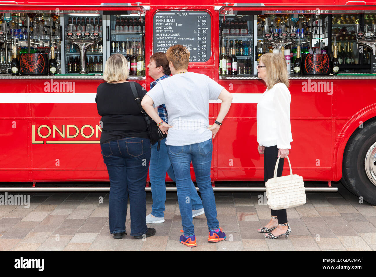 A red London double decker bus used as a mobile bar Stock Photo - Alamy