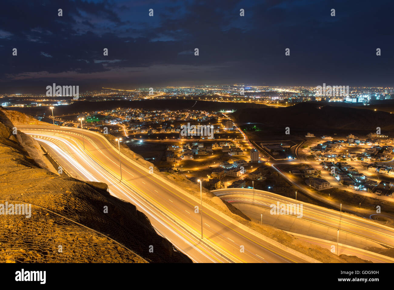 Night cityscape from the top of a high road overlooking Muscat, Oman ...