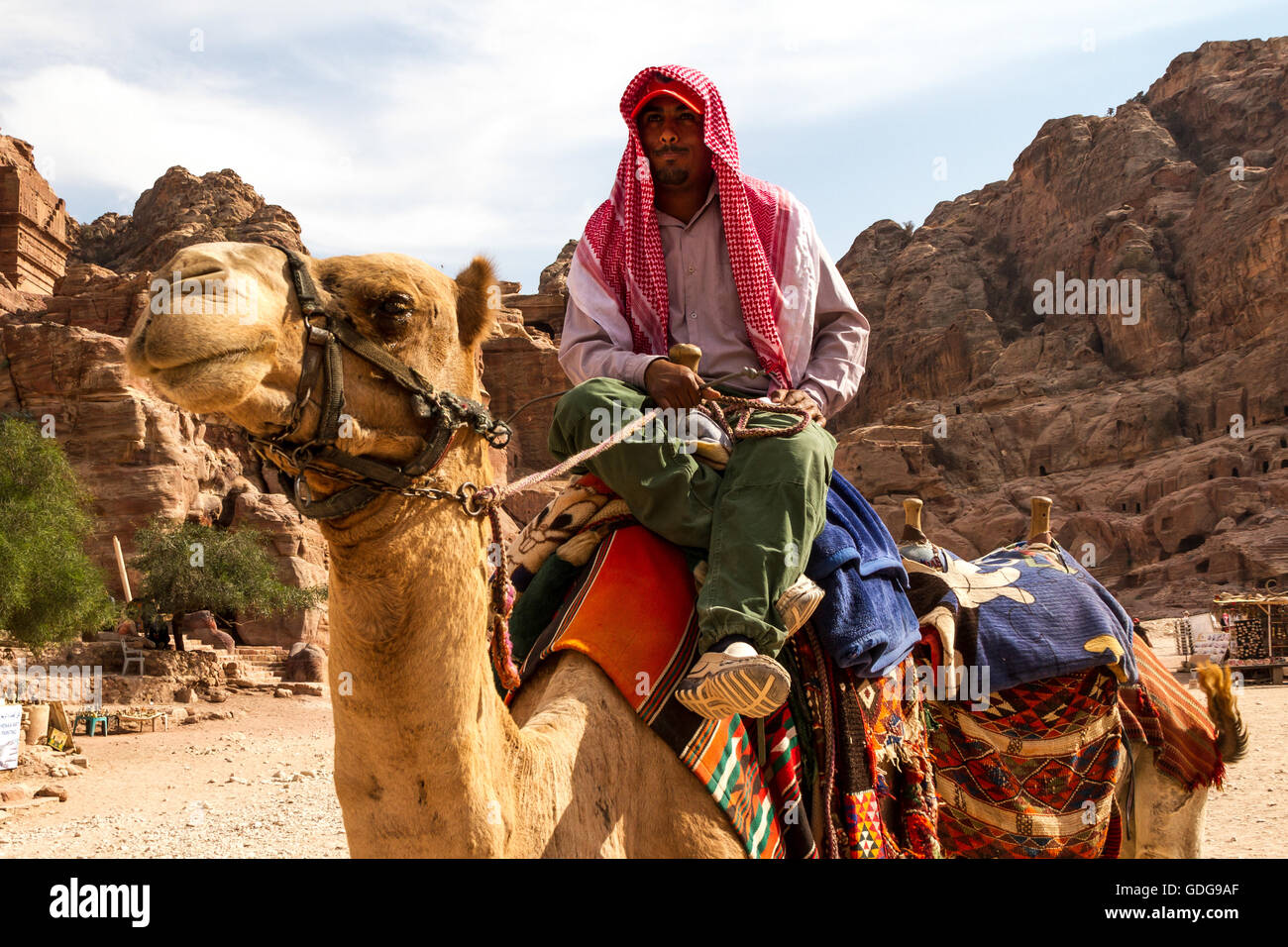 Camel ride through the ruins of Petra Stock Photo - Alamy