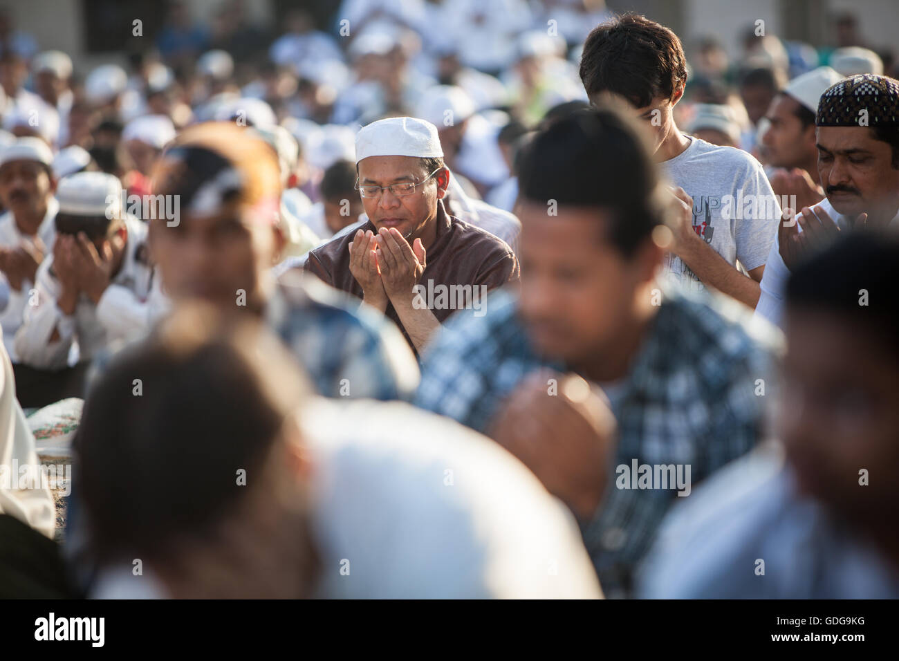 A man praying in the street, Dubai, United Arab Emirates Stock Photo ...