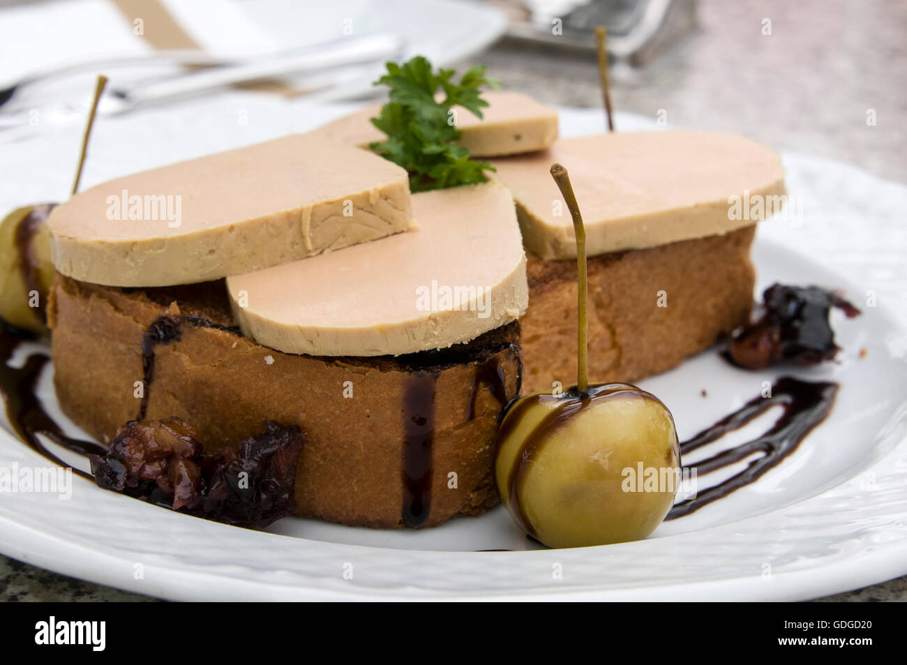A homemade Goose liver terrine on a thick slice of fresh buttery ...