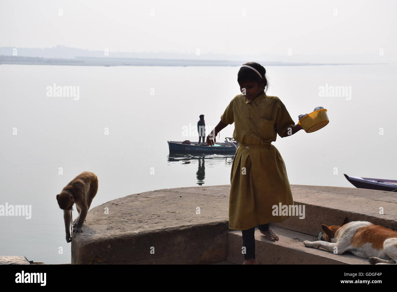Kid and monkey on the ghats of Varanasi, Uttar Pradesh, India Stock ...