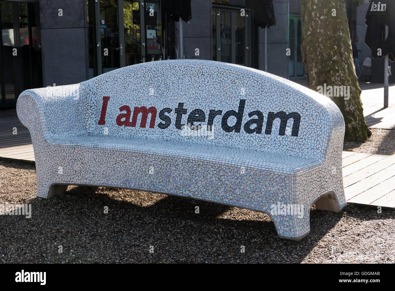 A bench with the statement ' I Amsterdam' on display outside in a park ...