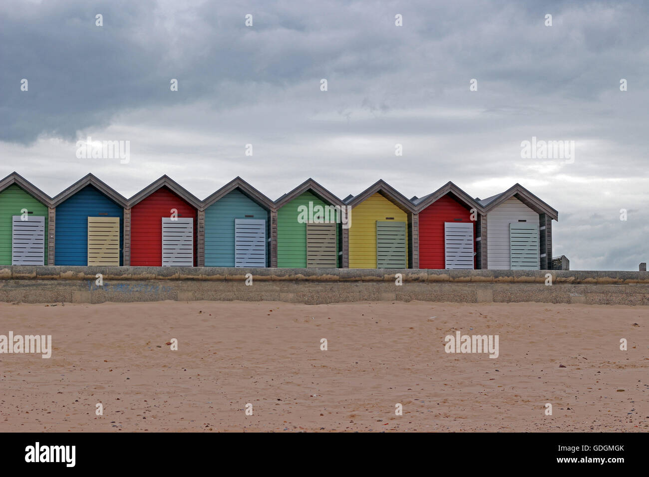 A line of colorful beach huts Stock Photo - Alamy