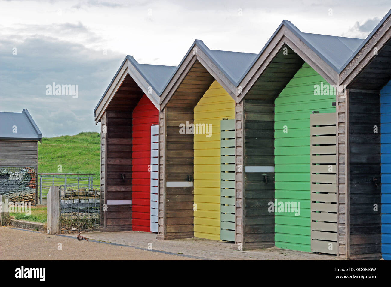A line of colorful beach huts Stock Photo - Alamy