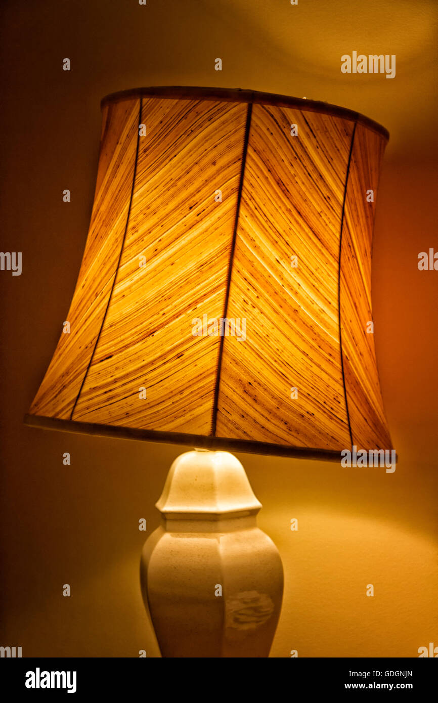 Decorated china table lamp on a window ledge in front of curtains Stock ...