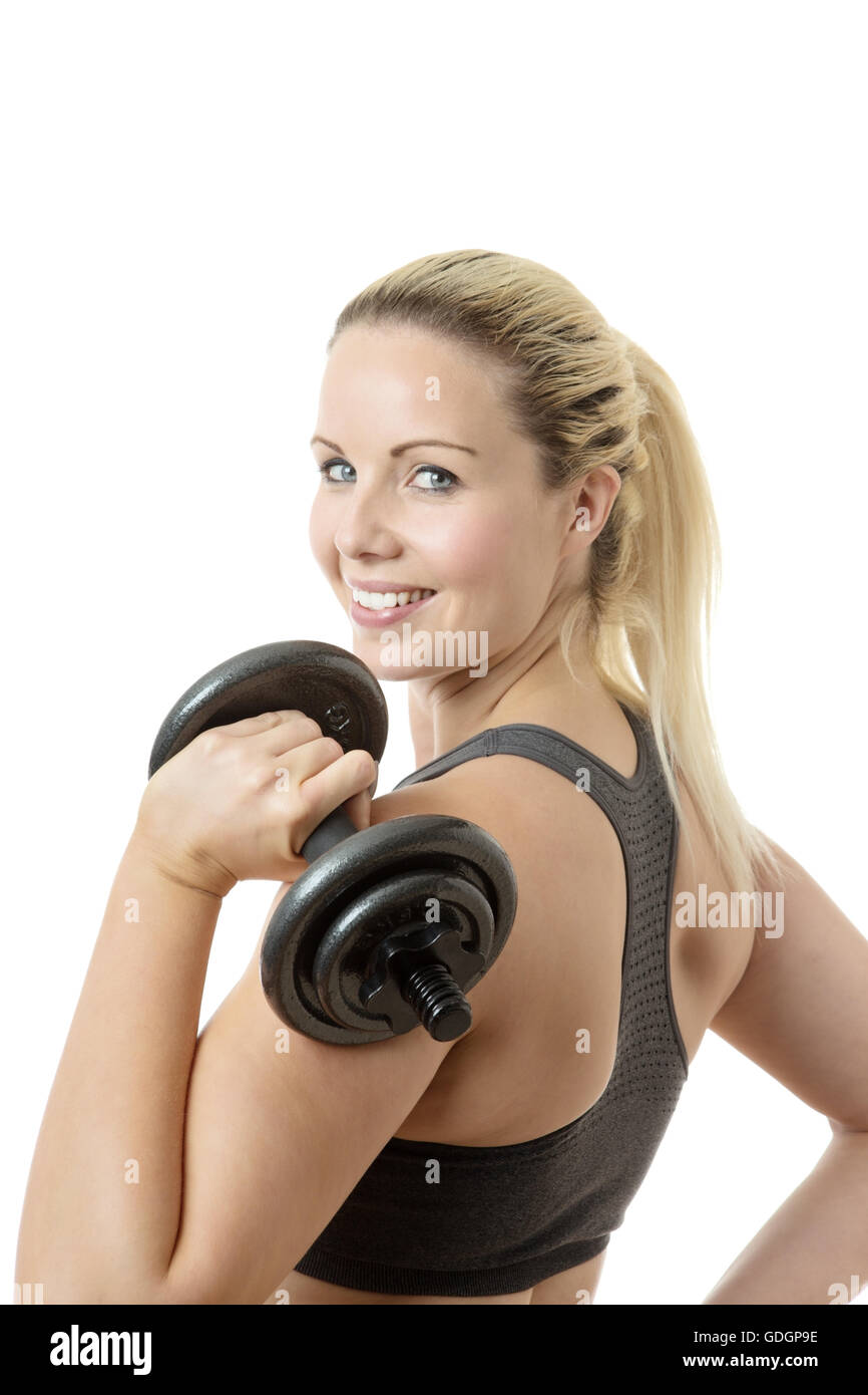 happy fitness woman with a great smile looking over her shoulder ...