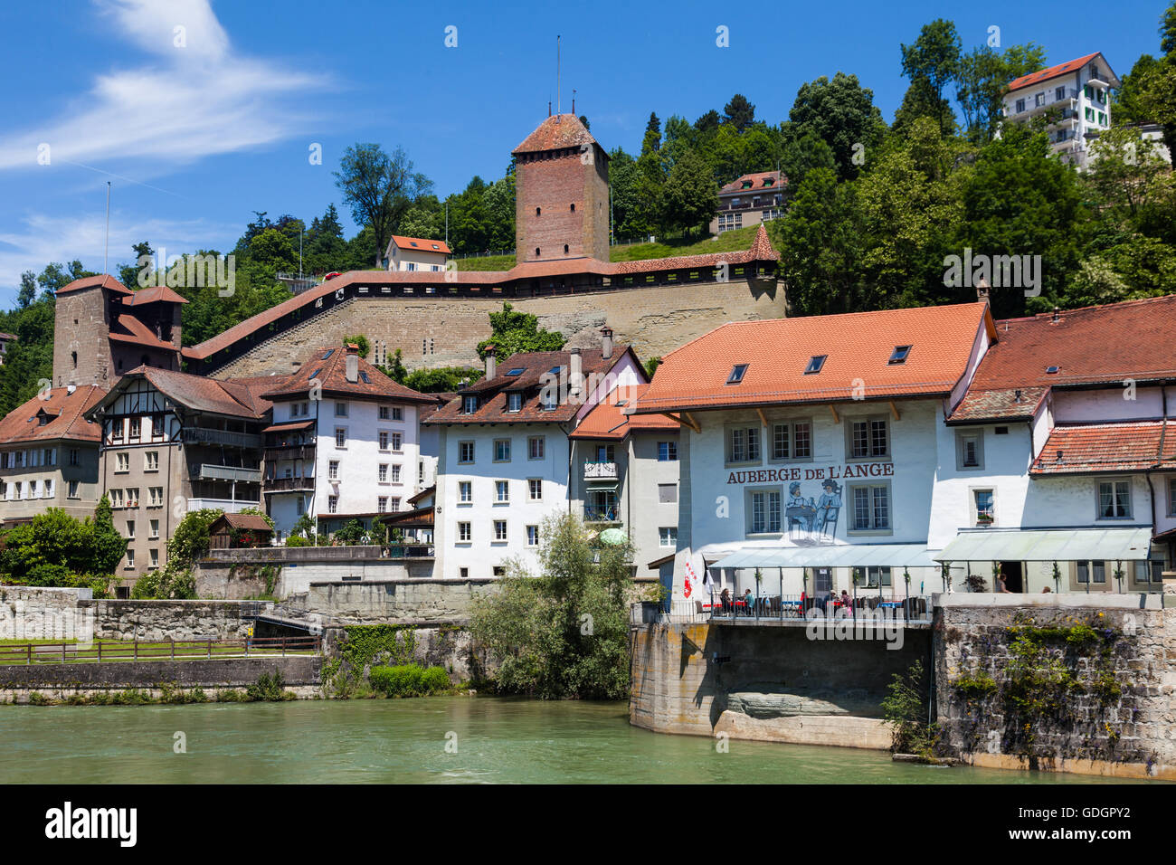 Riverside buildings and a preserved section of the old city wall of ...