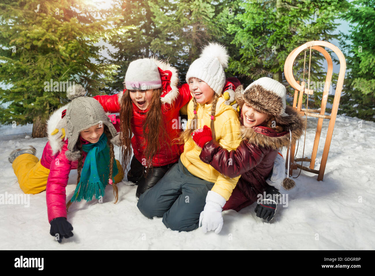 Friends playing together at winter games on snow Stock Photo - Alamy