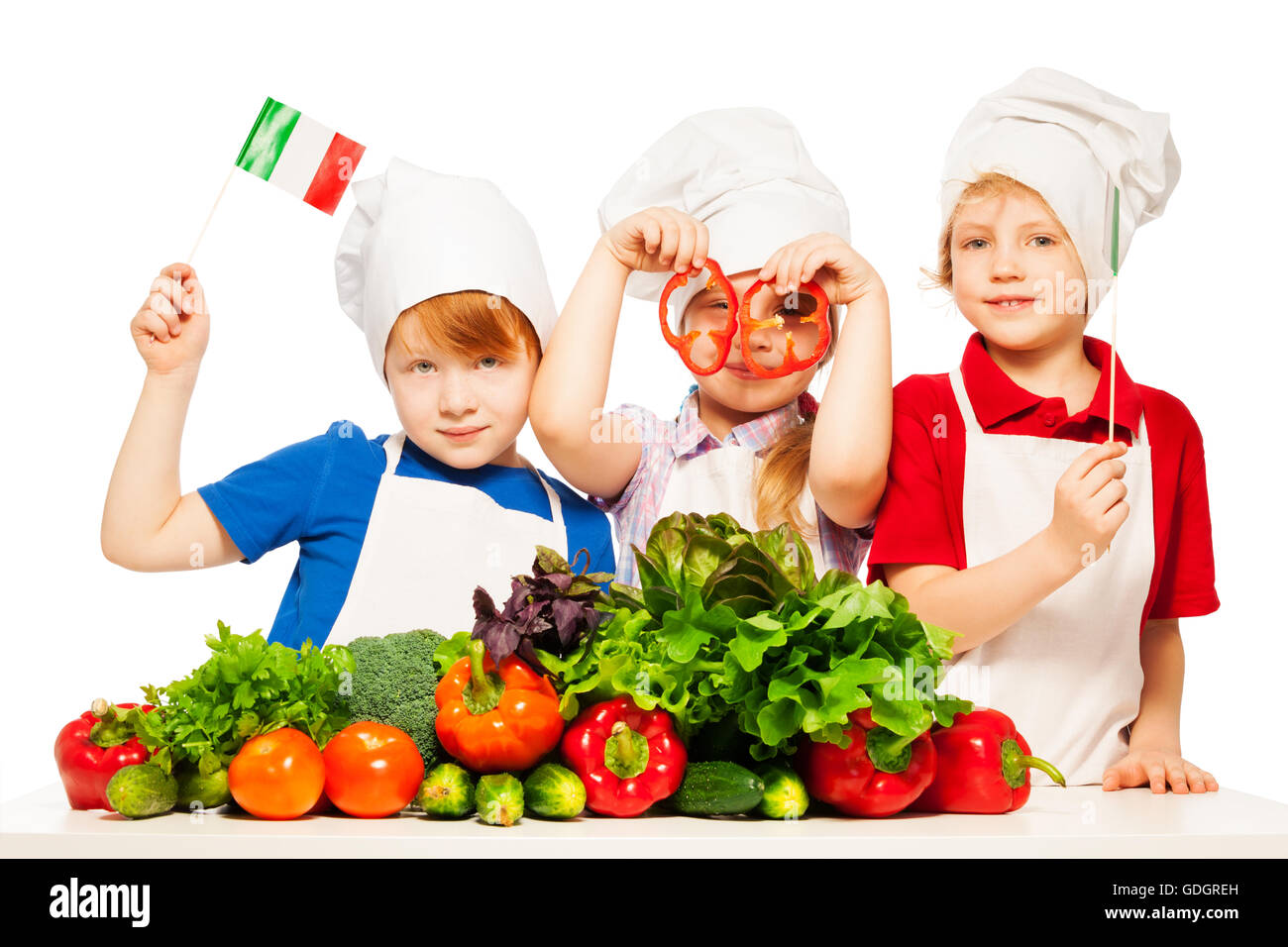 Three young cooks preparing Italian meal Stock Photo - Alamy